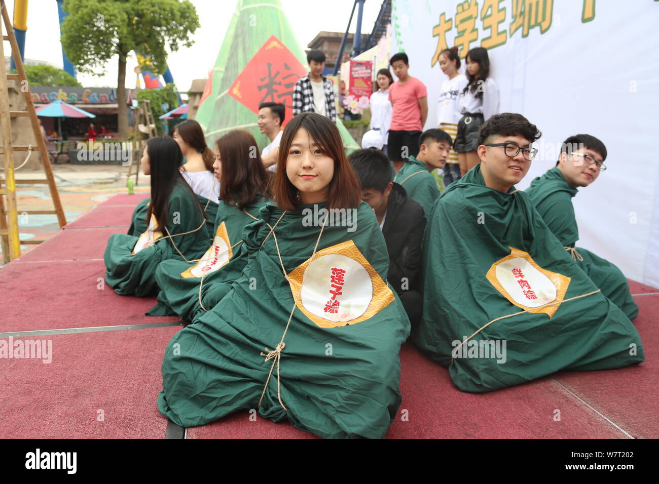 University students wrapped up as zongzi or glutinous rice dumplings ...