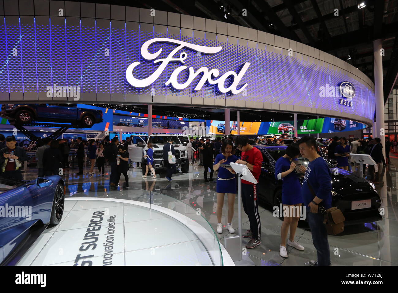 --FILE--Visitors are pictured at the stand of Ford during the 17th ...