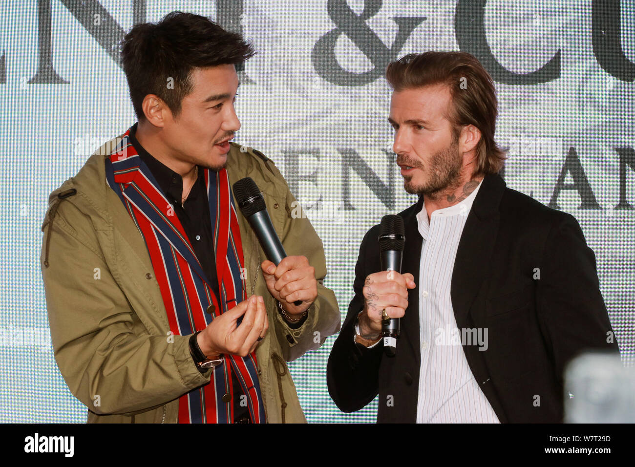 English soccer star David Beckham, right, attends a promotional event ...