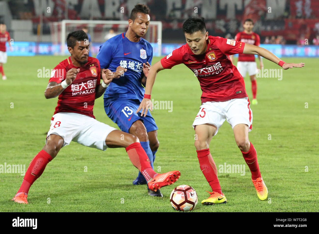 Brazilian football player Paulinho, left, of Guangzhou Evergrande ...