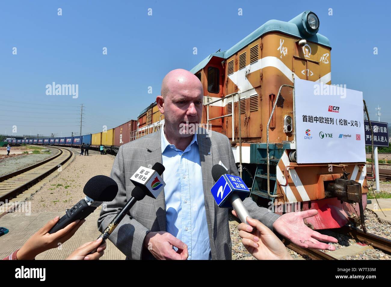 An executive of Geodis Wilson China Limited is interviewed in front of ...