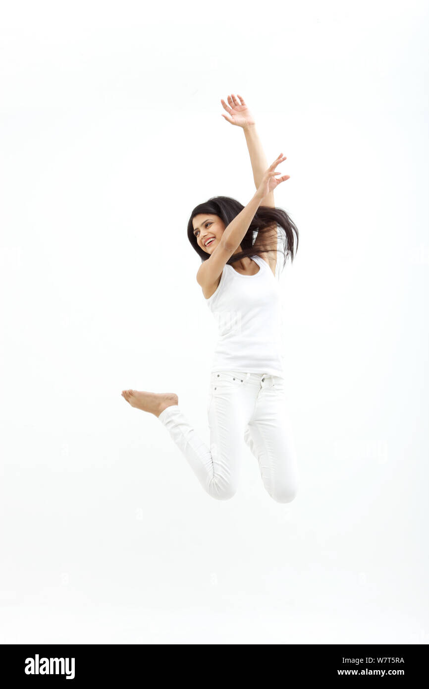 Indian girl jumping white background Cut Out Stock Images & Pictures ...