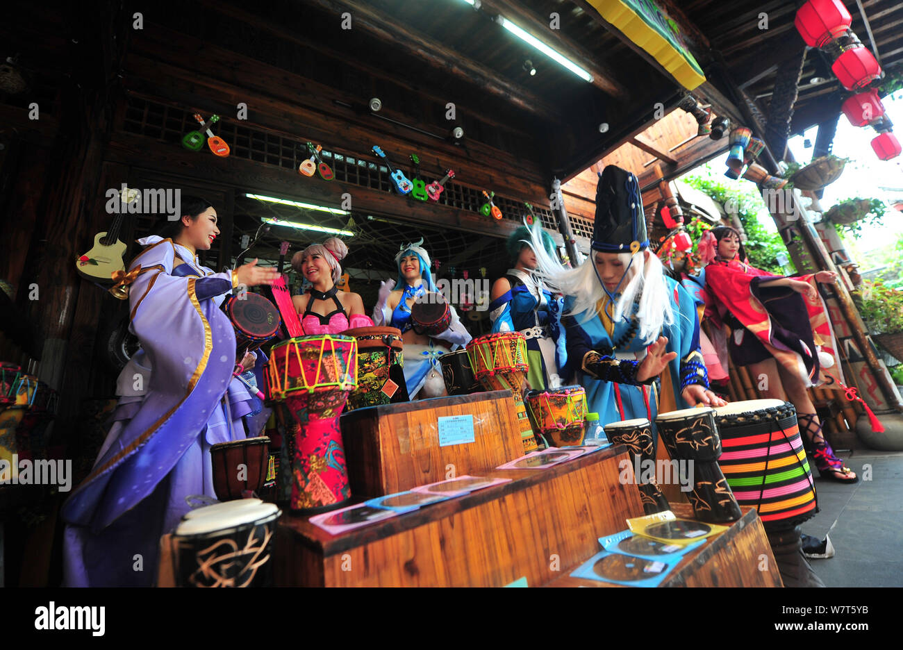 Chinese graduates dressed in cosplay costumes pose for graduation ...