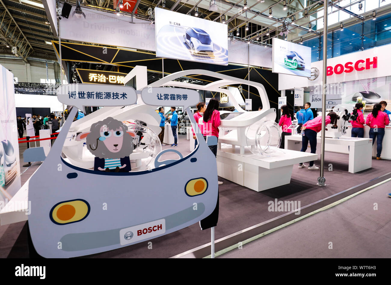 --FILE--Chinese employees are pictured at the stand of Bosch during the ...