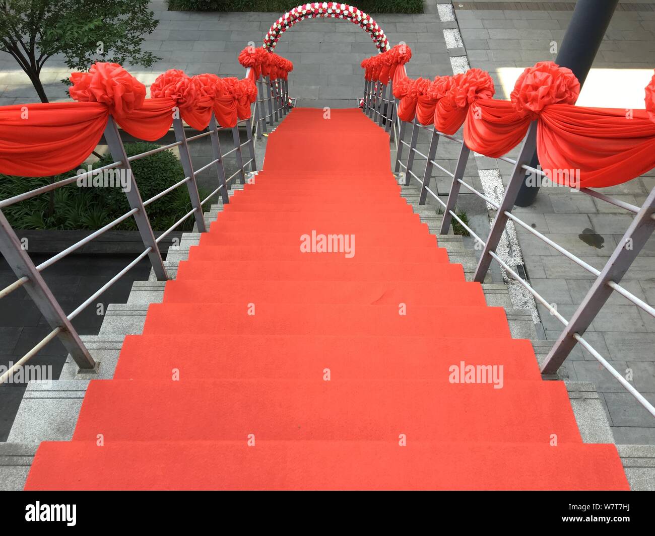 A 500-meter-long red carpet is displayed for a group wedding ceremony ...