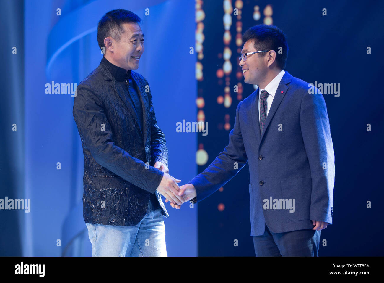 Chinese actor Hou Yong, left, attends the award ceremony for the 22nd Huading Awards ceremony in ...