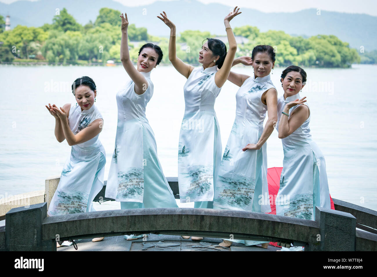 Women from different countries dressed in cheongsam, also known as ...