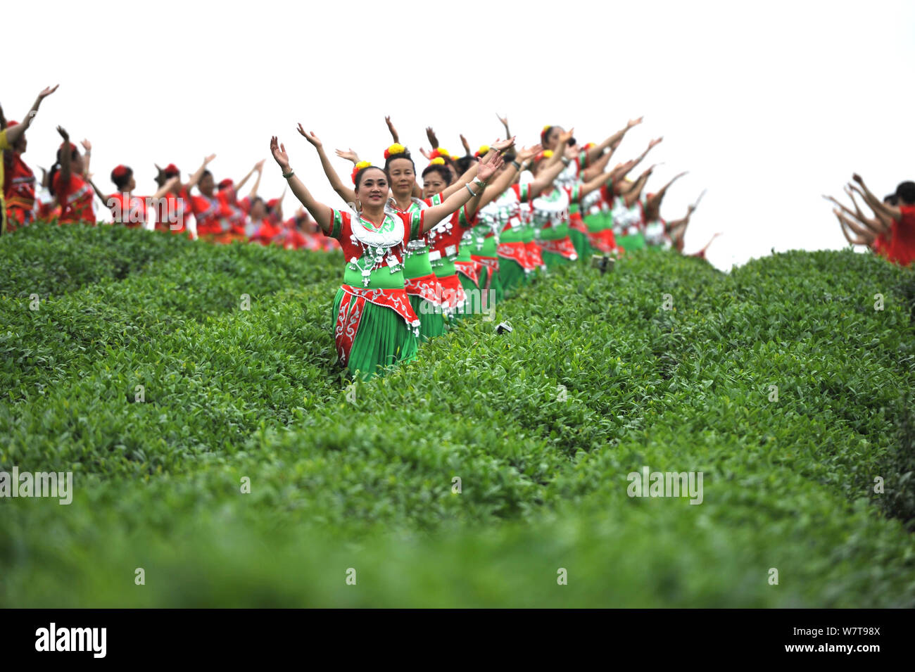 Chinese artists dressed in traditional costumes of Miao ethnic group ...
