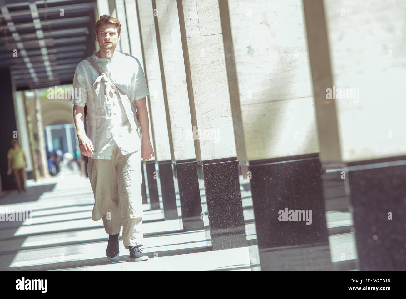 Russian man Dmitri, wearing traditional Chinese clothes and carrying a ...