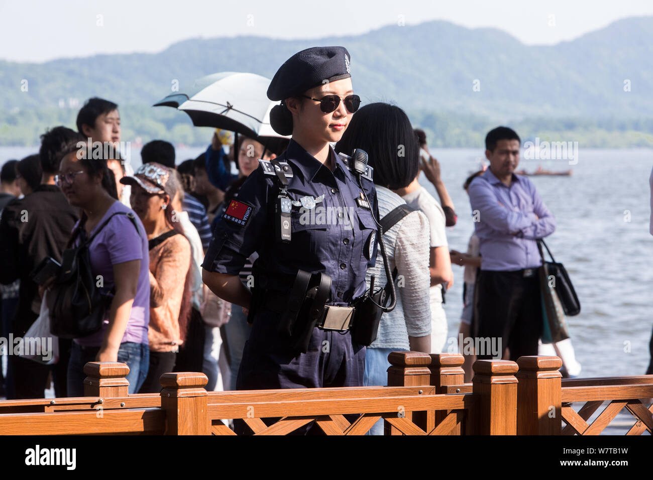 A female guard stands guard at the West Lake scenic spot during the ...