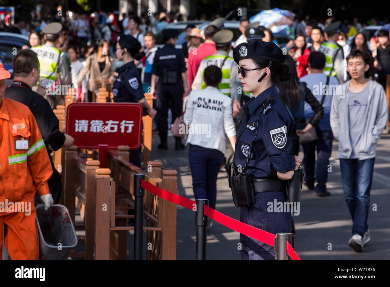 A female guard stands guard at the West Lake scenic spot during the ...