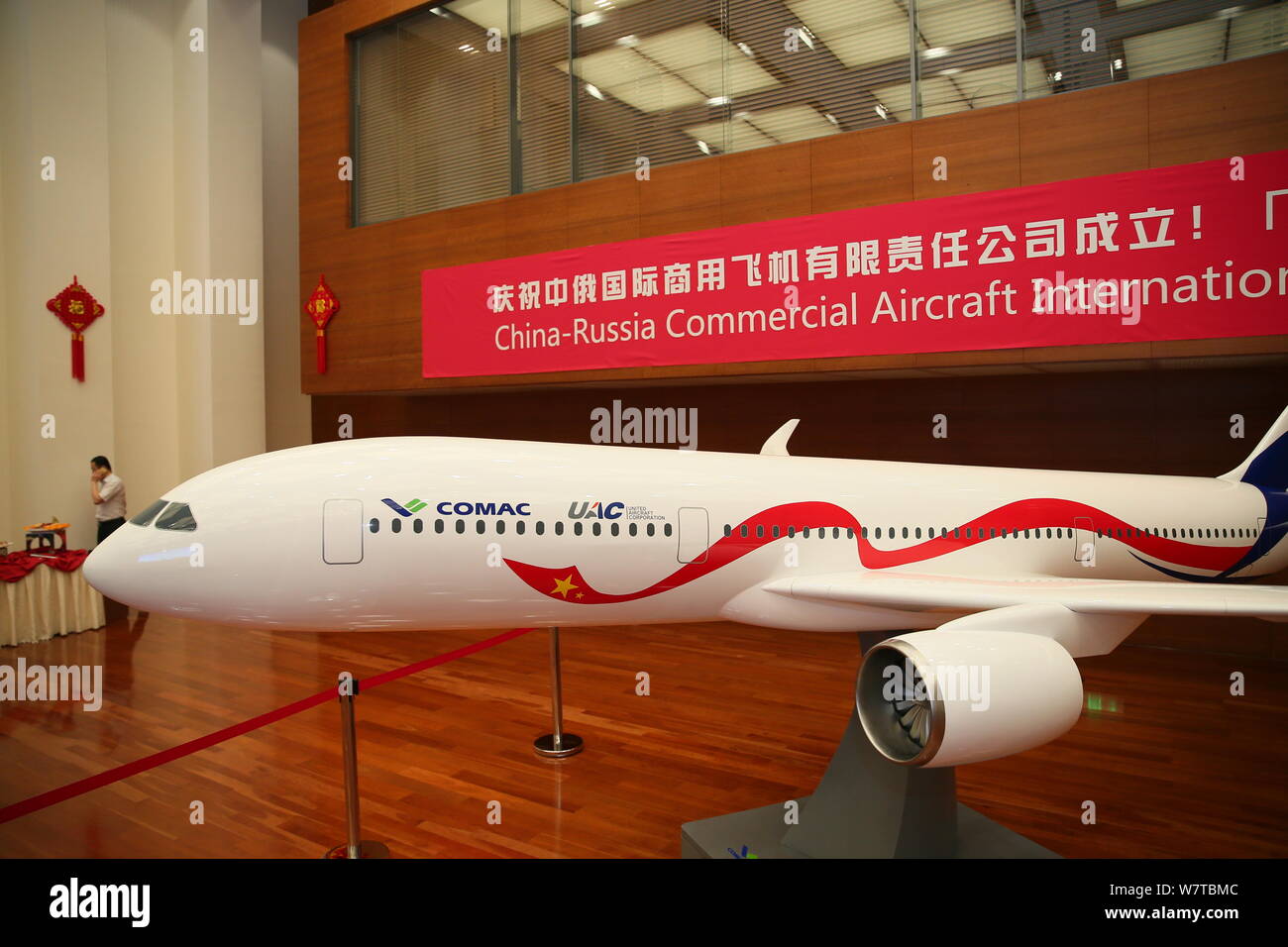 A model of a wide-body passenger jet is on display at the inauguration ...