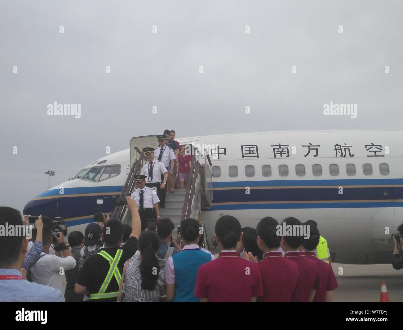 Flight crew members deplane after the last Boeing 737-300 passenger jet ...