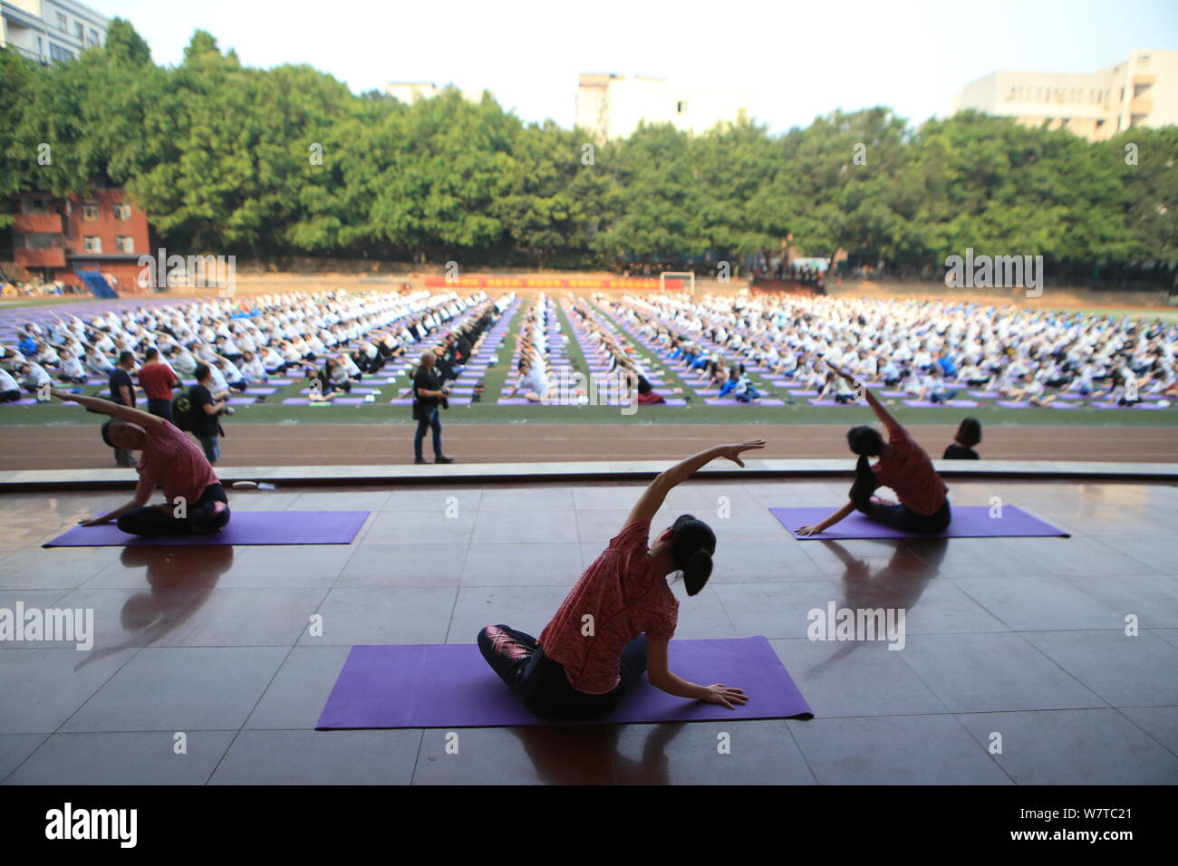 Chinese students practice yoga in group to ease tension and anxiety ...