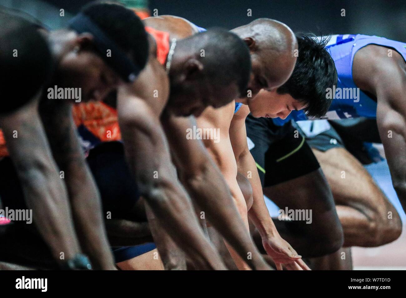 Athletes get ready for the men's 100m final during the IAAF Diamond ...