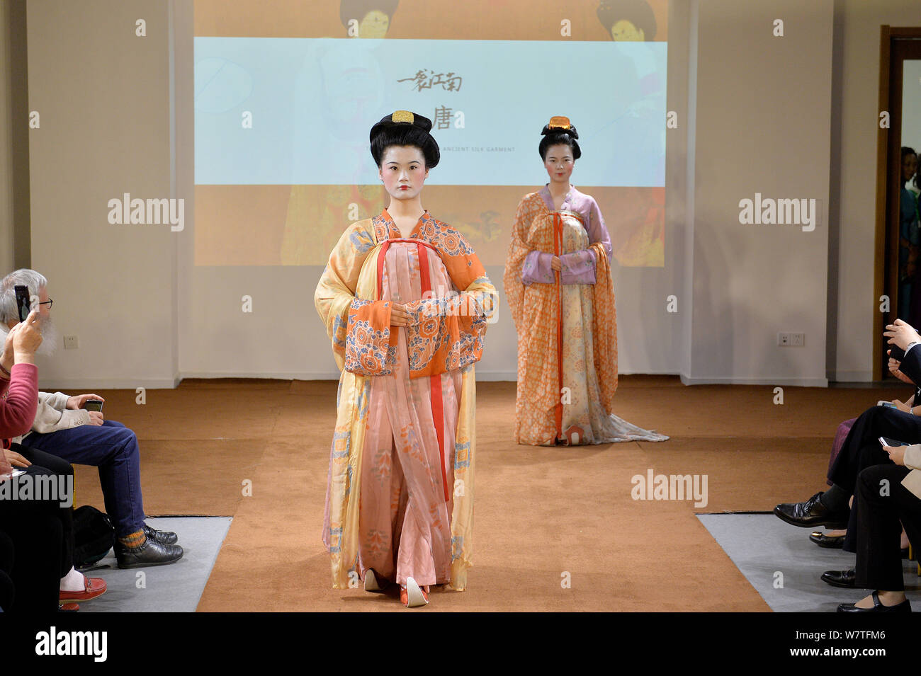 Models present traditional Chinese costumes at Jiangnan Silk Museum in ...
