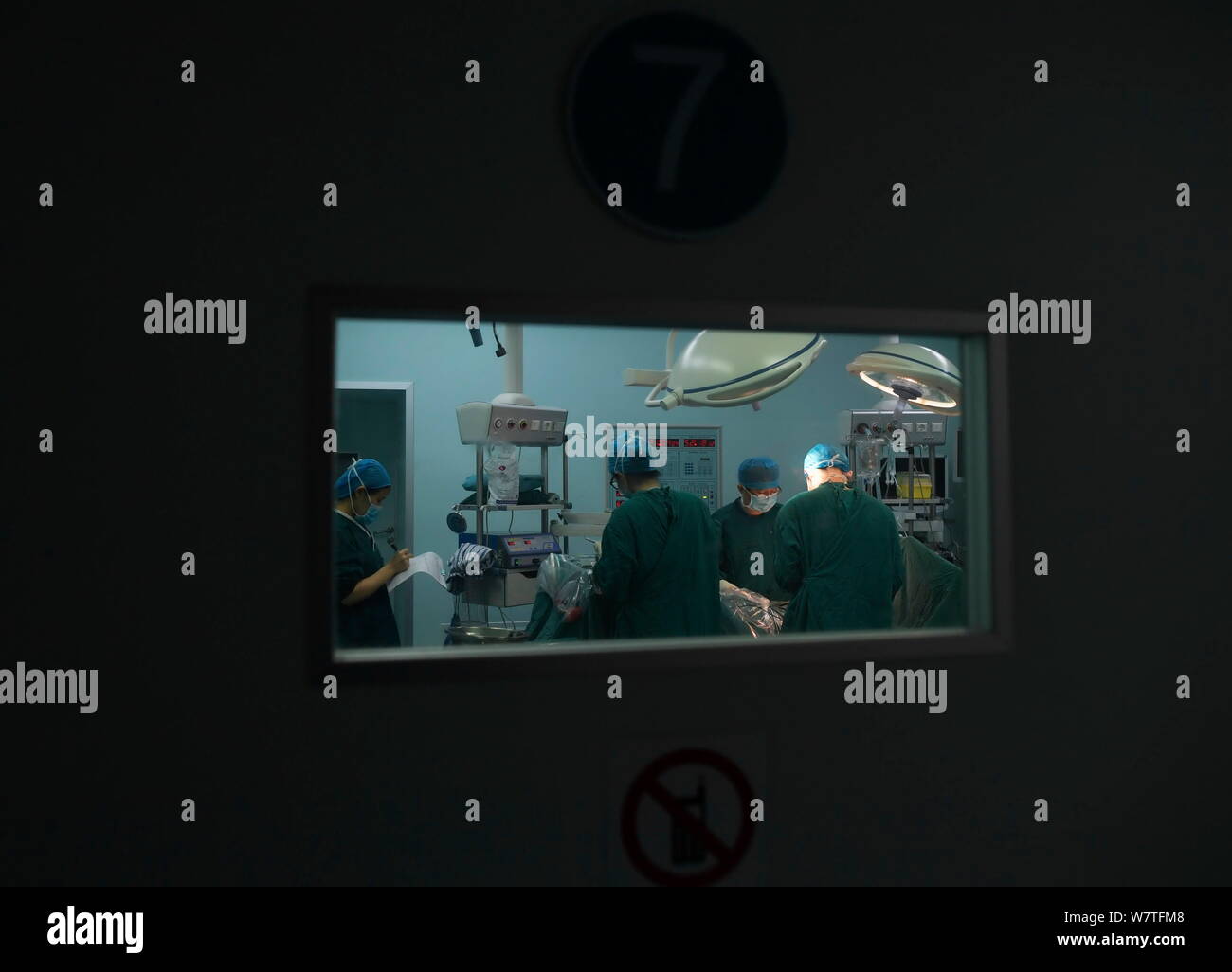 Chinese doctor Jiang Yuequan conducts a surgery on a patient at a tumor ...