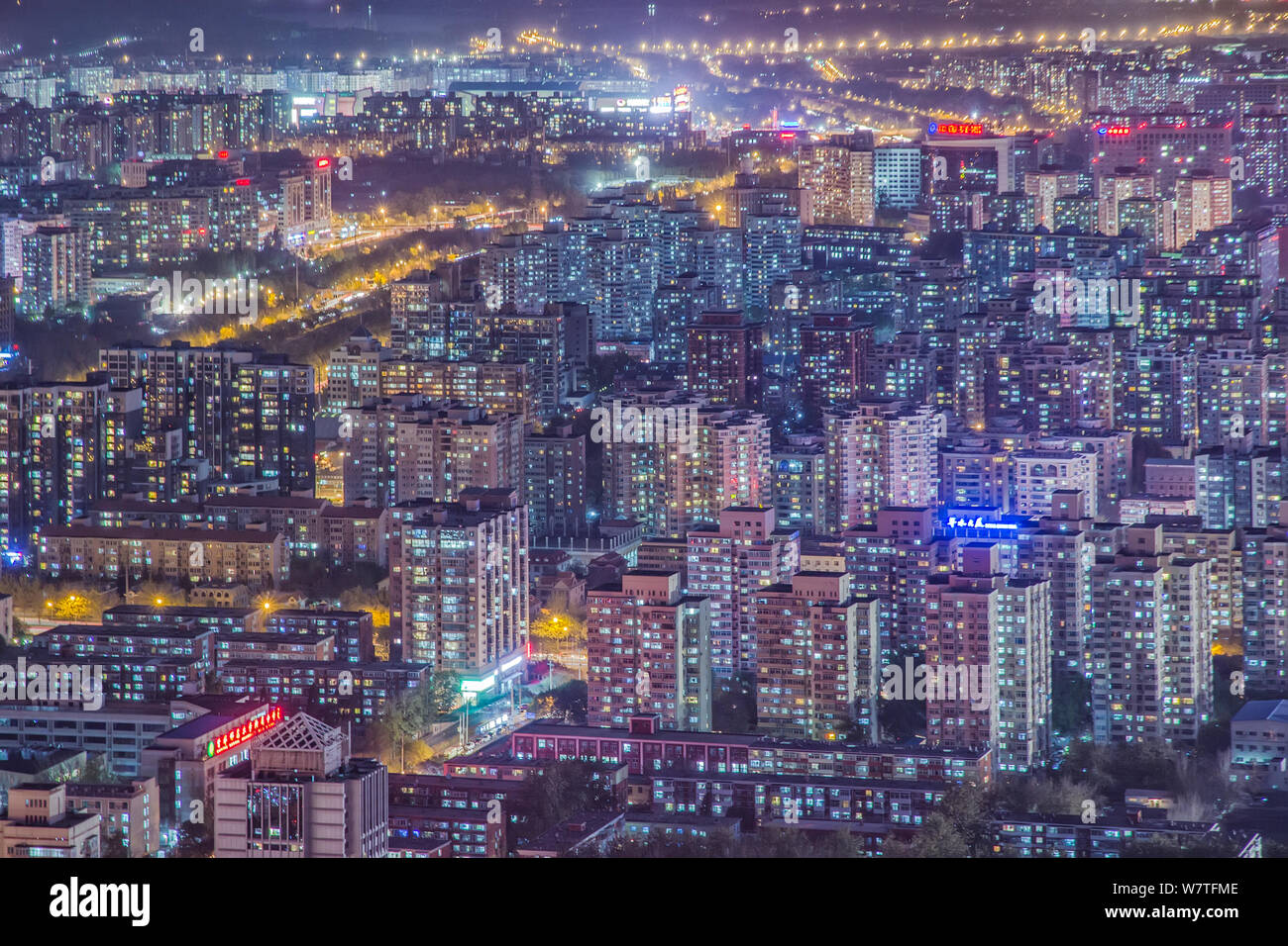 Night view of a cluster of residential high-rise buildings in Beijing ...