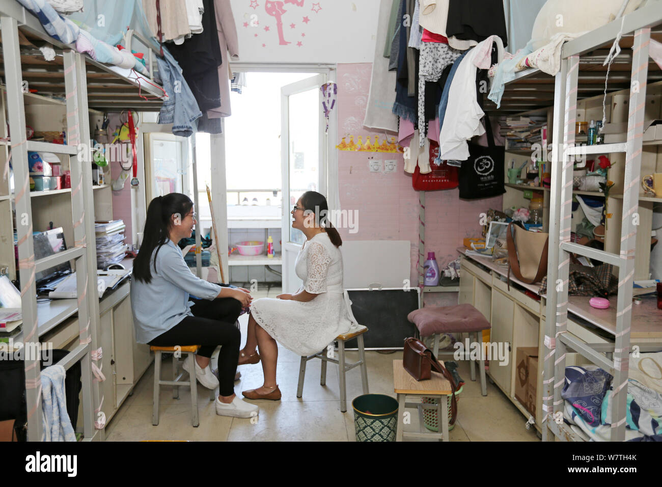 21-year-old Chinese student Tang Lisha, left, who comes from a poor ...