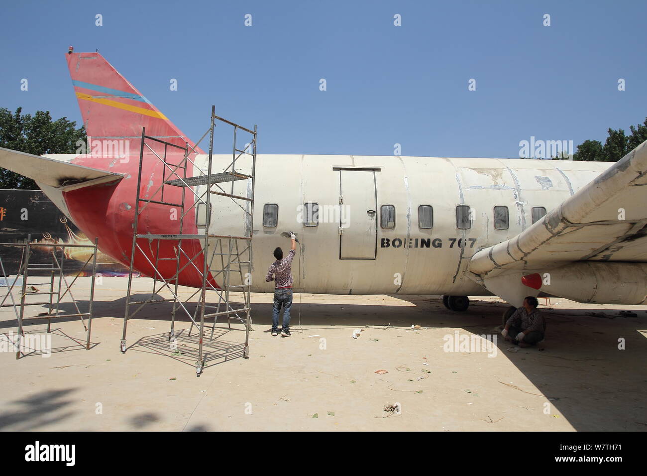 An old plane with "Boeing 767" and "QANTAS" on its fuselage is pictured ...