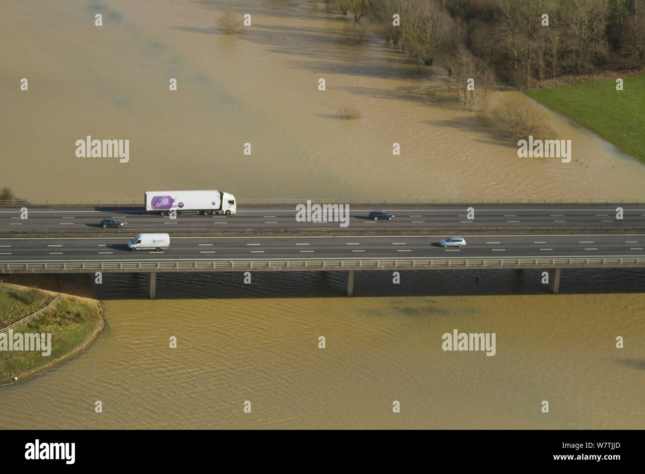 Aerial view of floods surrounding M50 motorway with bridge over River ...