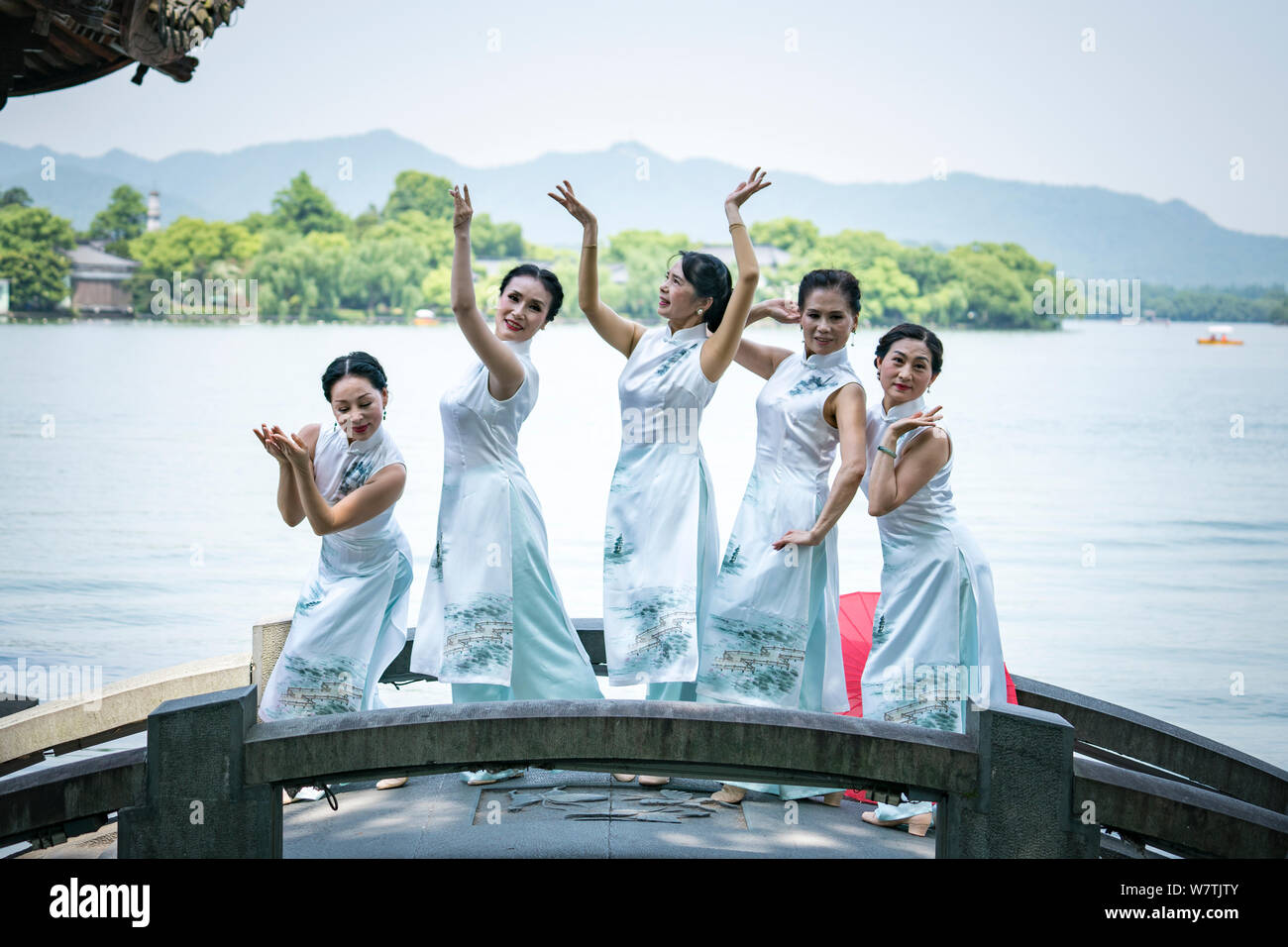 Women from different countries dressed in cheongsam, also known as ...