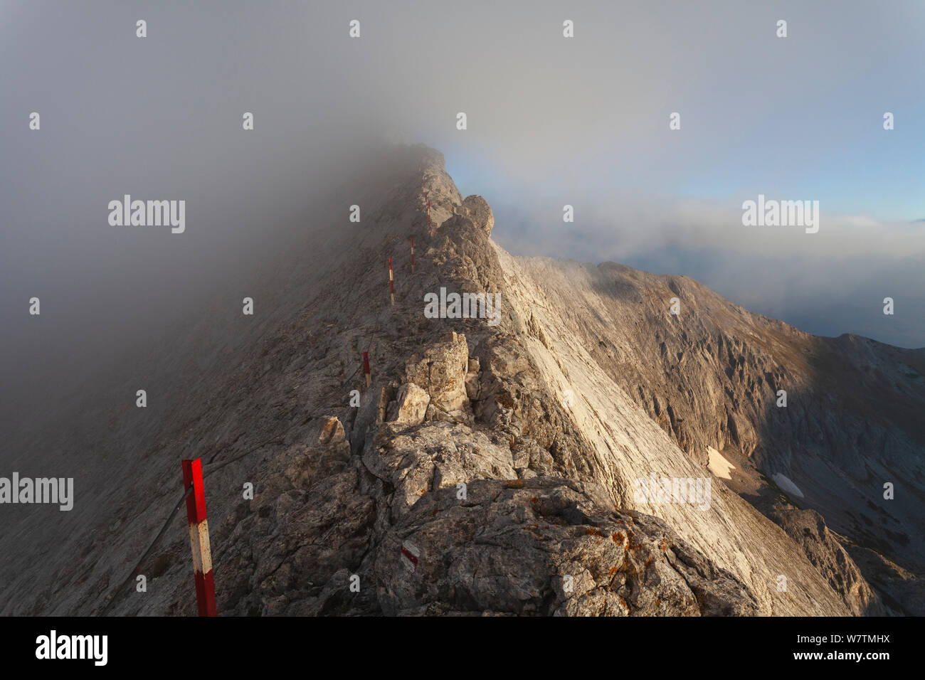 Danger mountain pass on the edge between the peaks Stock Photo - Alamy