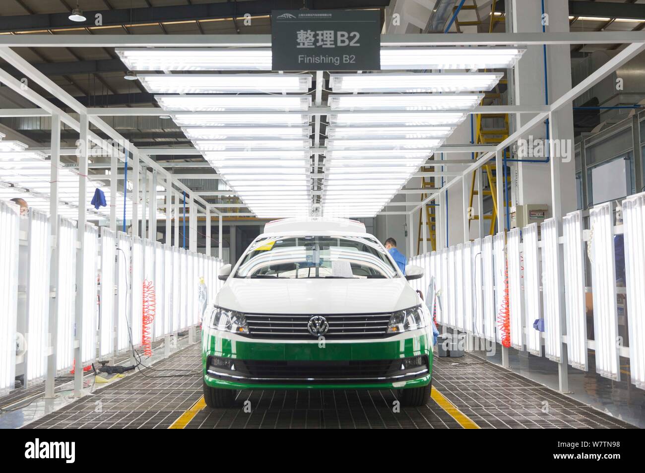 --FILE--Cars are being assembled on the assembly line at an auto plant ...