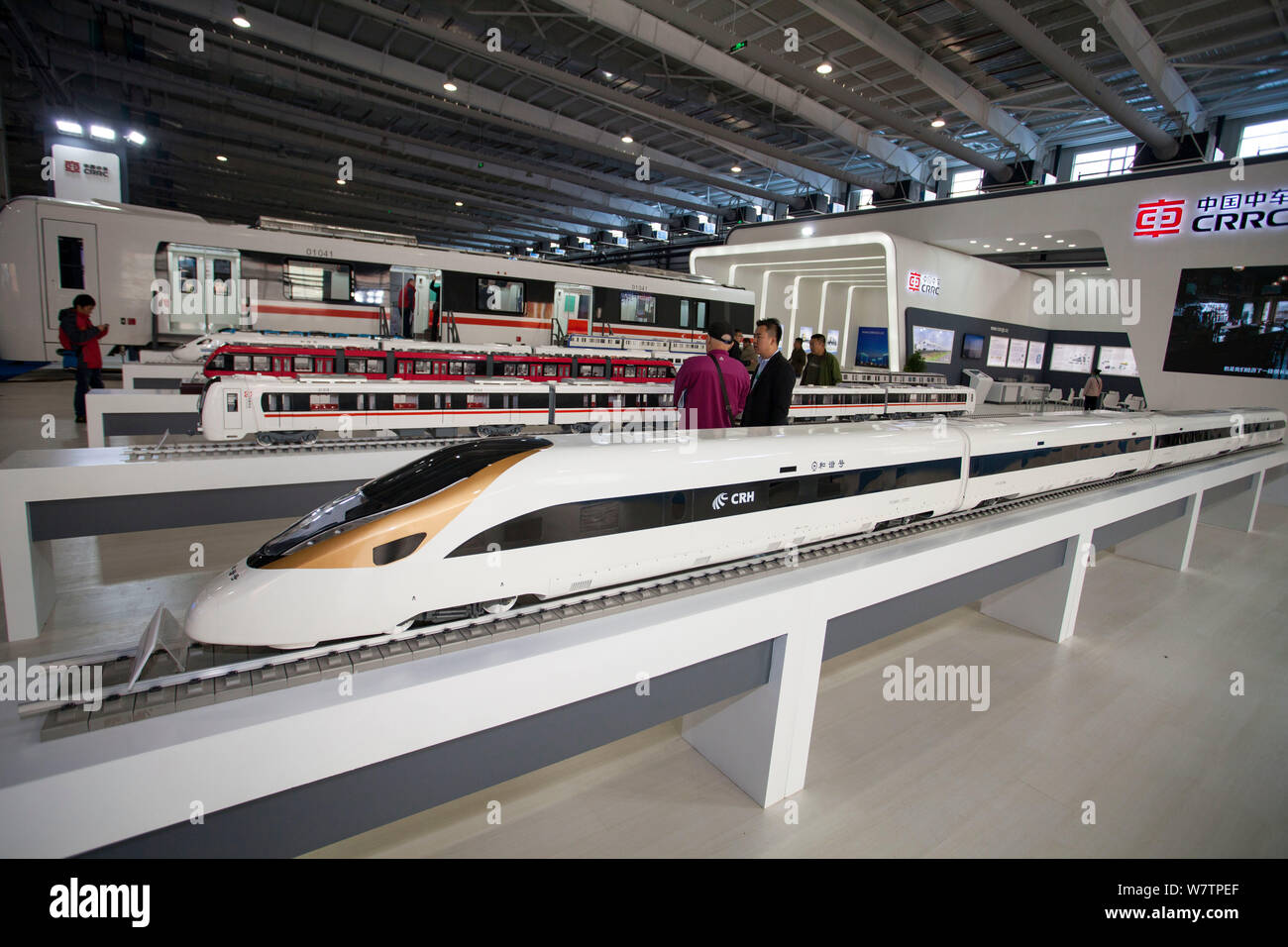 --FILE--Visitors look at models of a CRH (China Railway High-speed ...