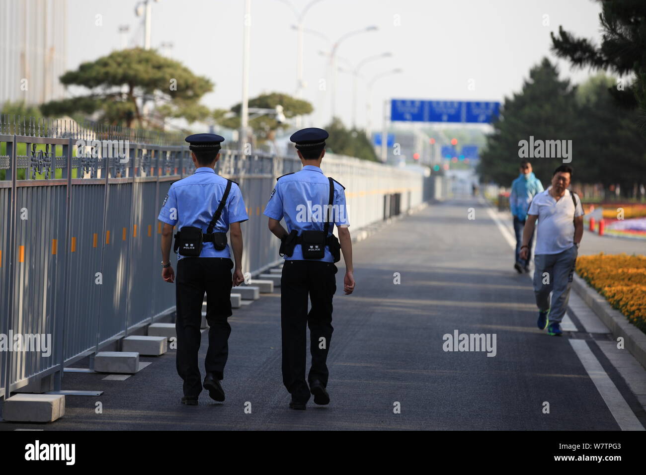 Chinese police officers patrol the China National Convention Center ...