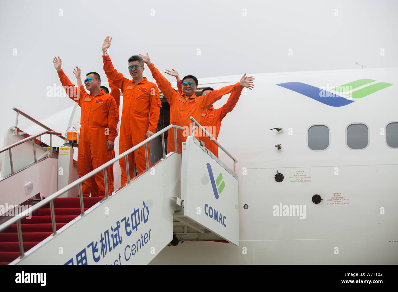 Flight crew members wave as they deplane after China's first ...