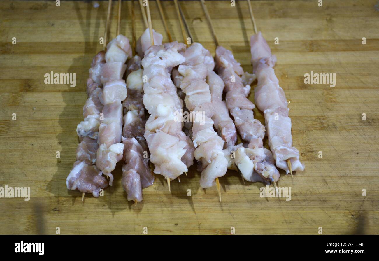 View of crocodile meat for sale at a roadside barbeque vendor in ...