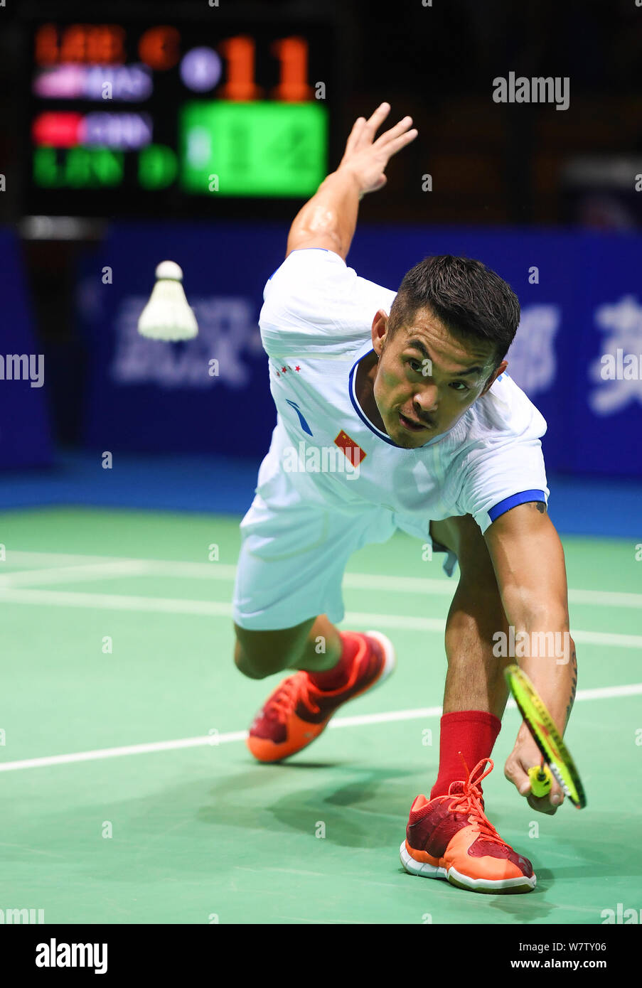 Lin Dan of China returns a shot to Lee Chong Wei of Malaysia in their ...