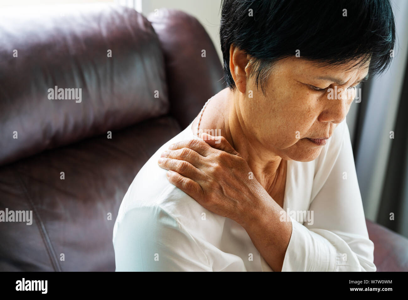 neck and shoulder pain, old woman suffering from neck and shoulder ...