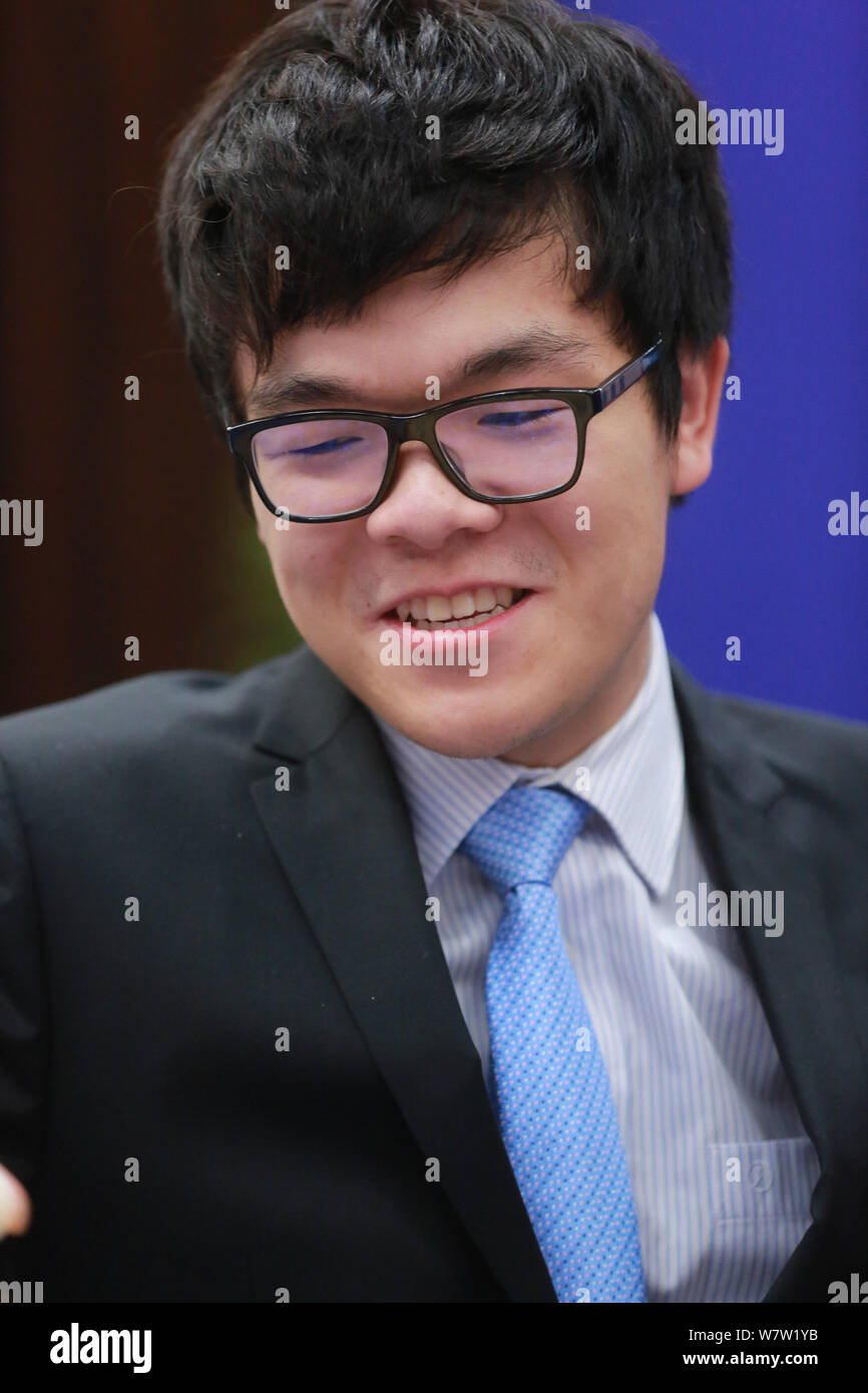Chinese Go player Ke Jie smiles as he resigns in the second game of the ...