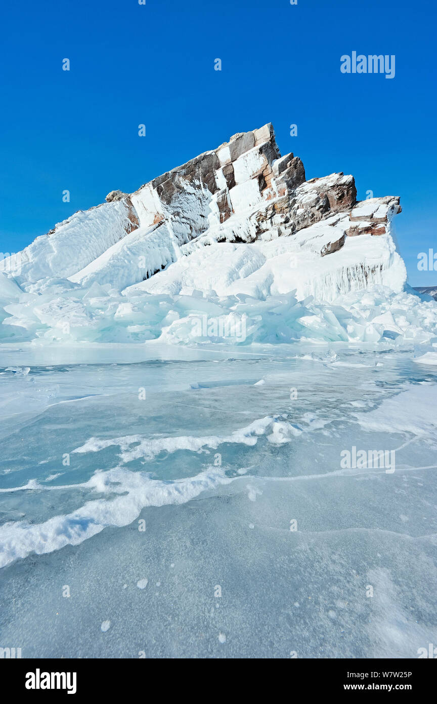 Shore of Lake Baikal, with ice pile, splash out ice, and cracks, Lake ...