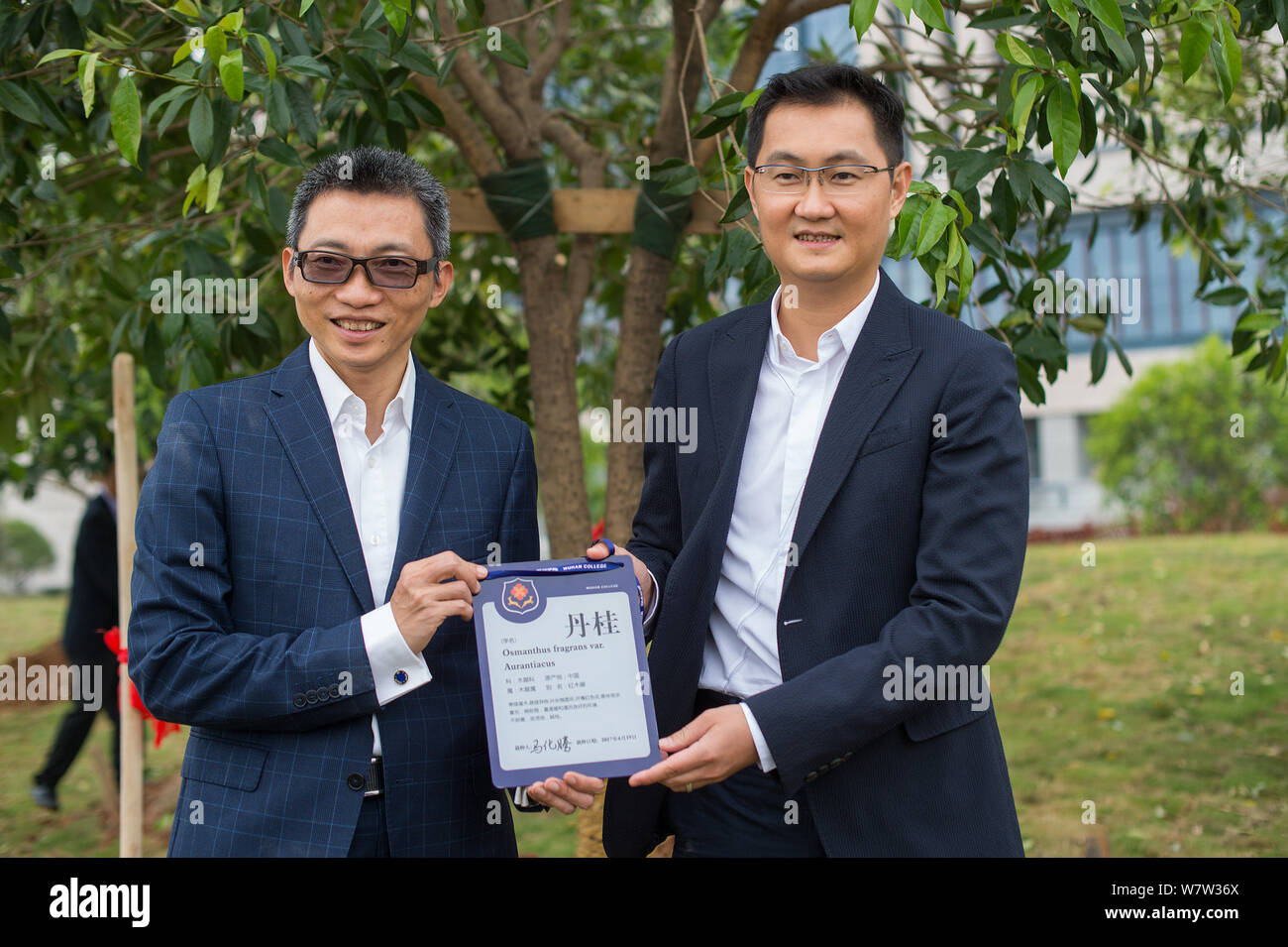 Chen Yidan, left, co-founder of Tencent Holdings Ltd., and Pony Ma ...