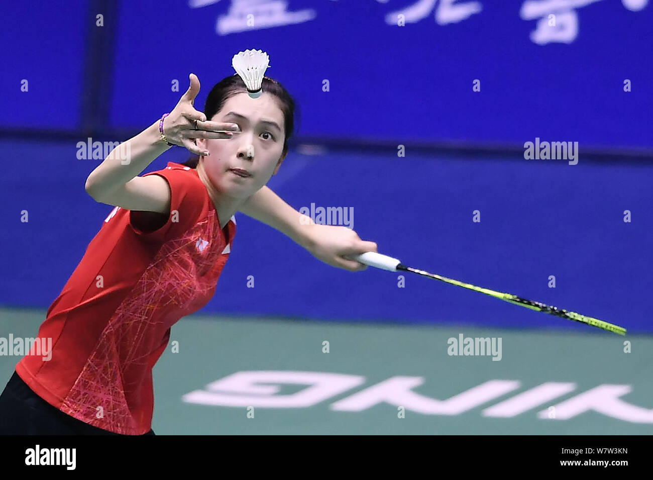 Aya Ohori of Japan serves against Gao Fangjie of China in their women's ...