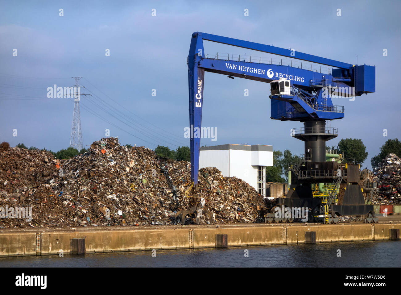 Dock crane and heap of scrap metal for recycling, Port of Ghent ...