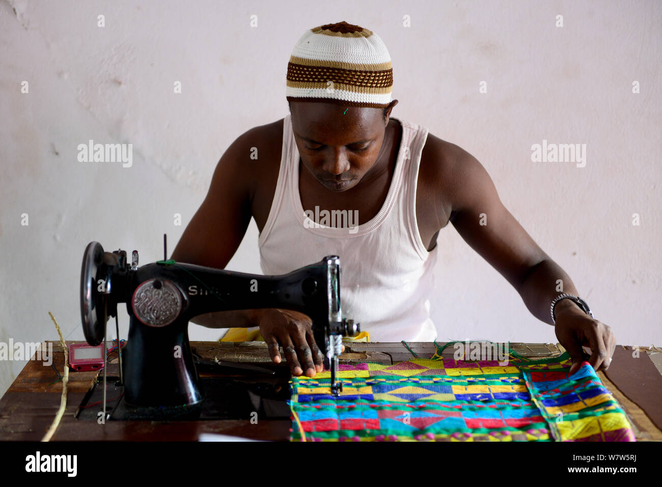 Man sewing hi-res stock photography and images - Alamy