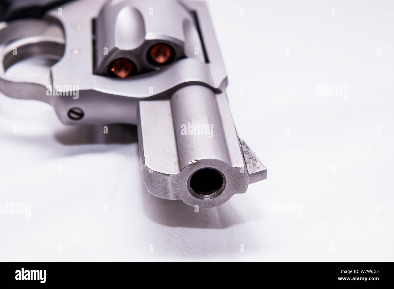 A 357 magnum snub nosed revolver loaded with hollow point bullets on a white background Stock ...