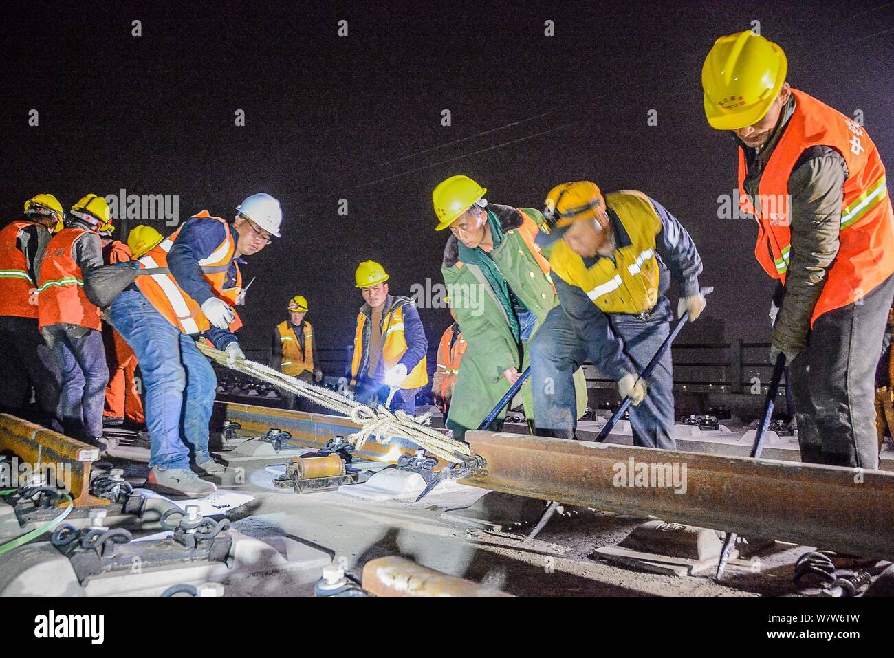 Chinese workers labor at the construction site of the high-speed ...