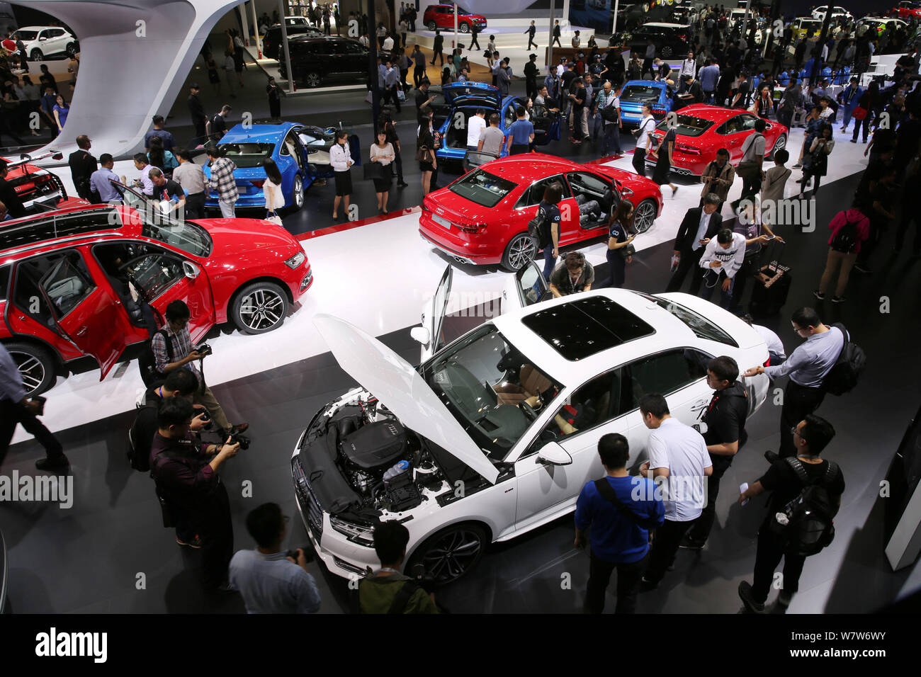 --FILE--Crowds of visitors look at cars during the 14th Beijing ...