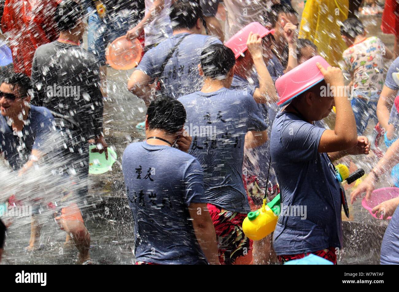 Local people and tourists sprinkle water to celebrate the Water ...