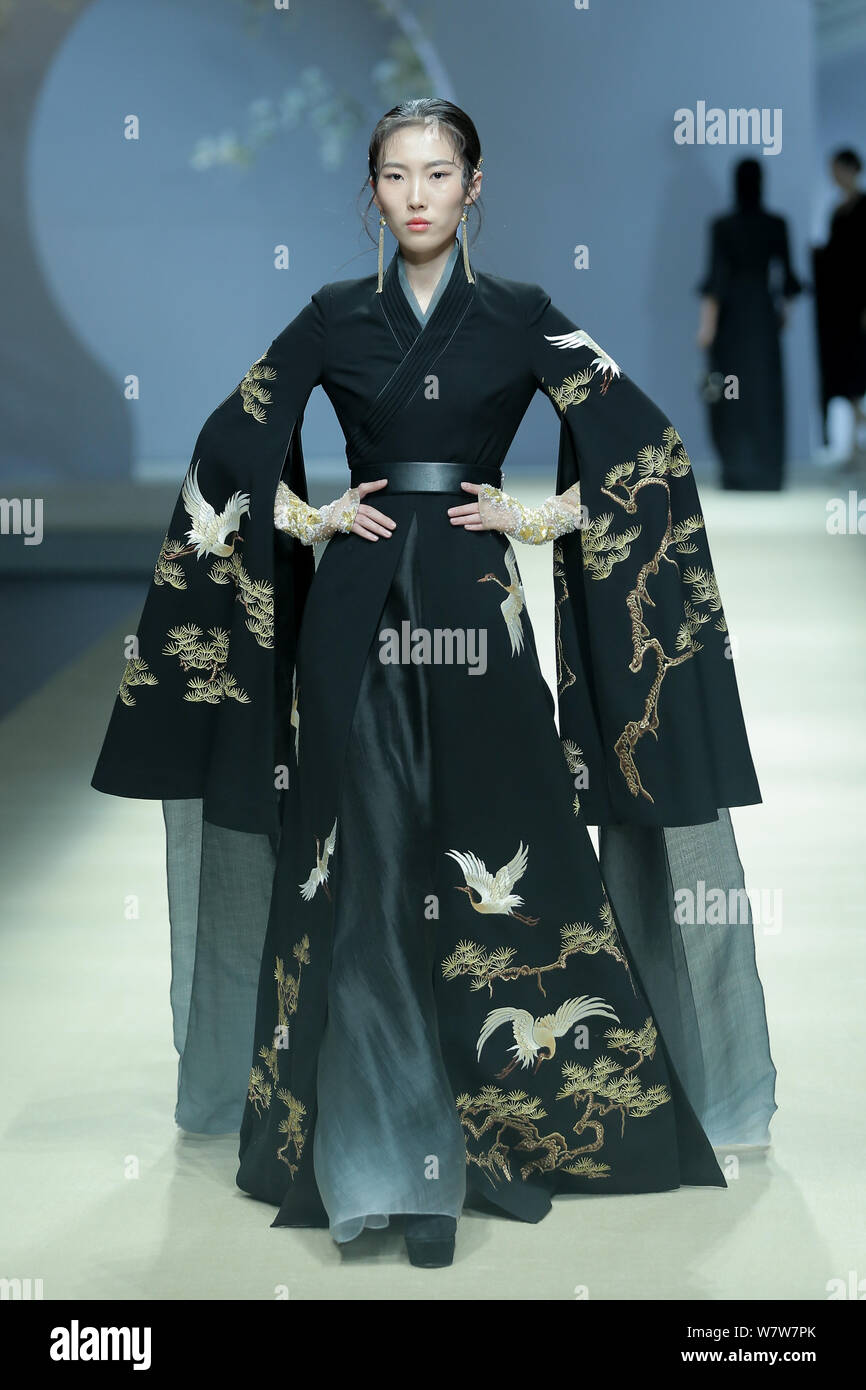 A model displays a new creation at the fashion show of Heaven Gaia by ...