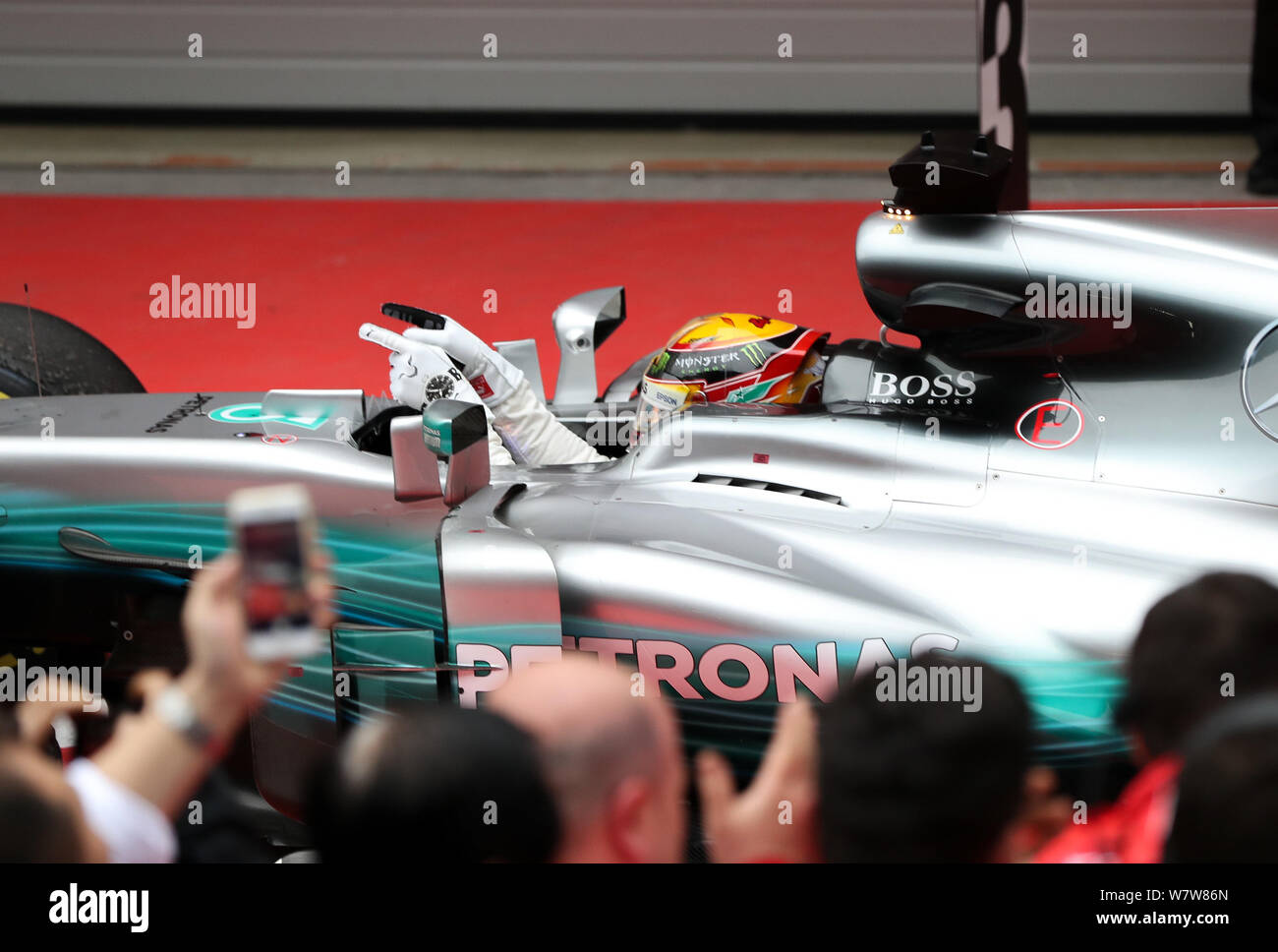 British F1 driver Lewis Hamilton of Mercedes celebrates after winning ...