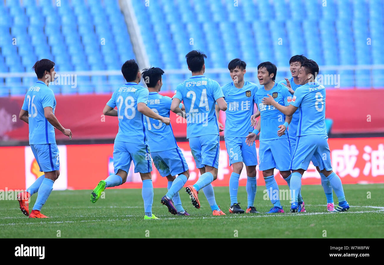 Players of Jiangsu Suning celebrate after scoring a goal against ...
