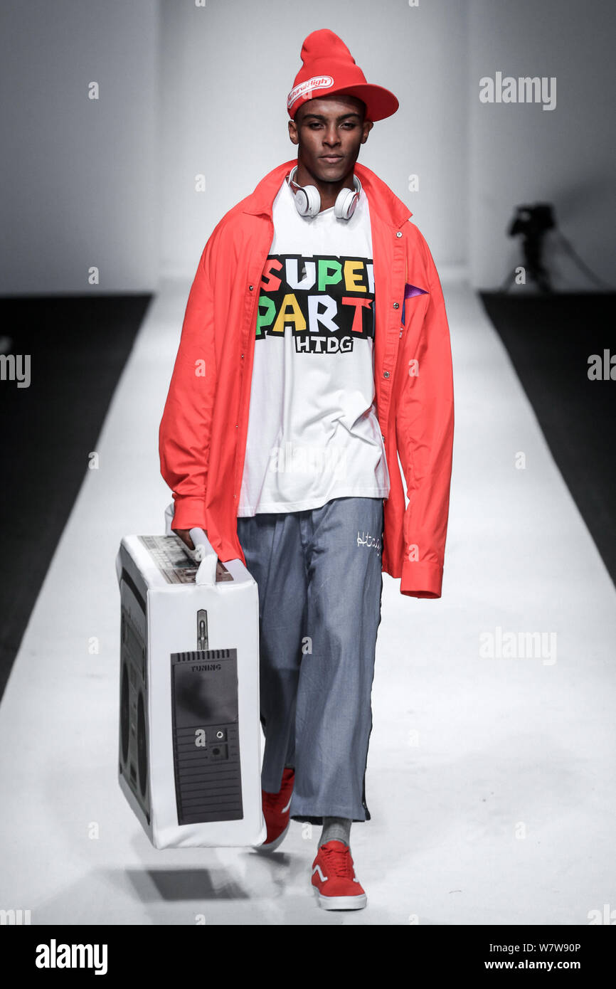 A model displays a new creation at the fashion show of SOLO CELEB. and ...