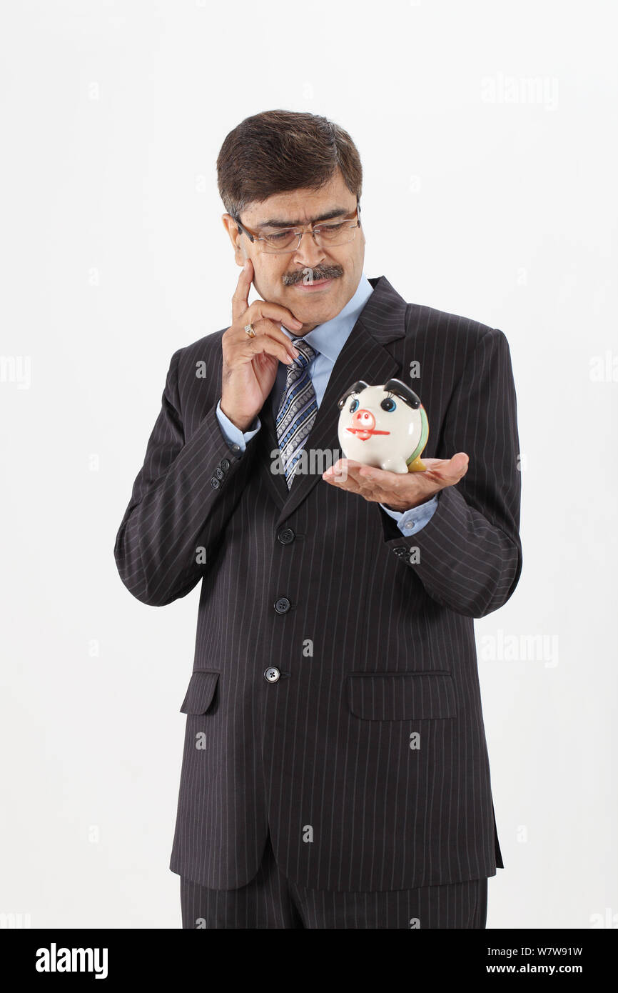 Indian businessman old man thinking hi-res stock photography and images ...