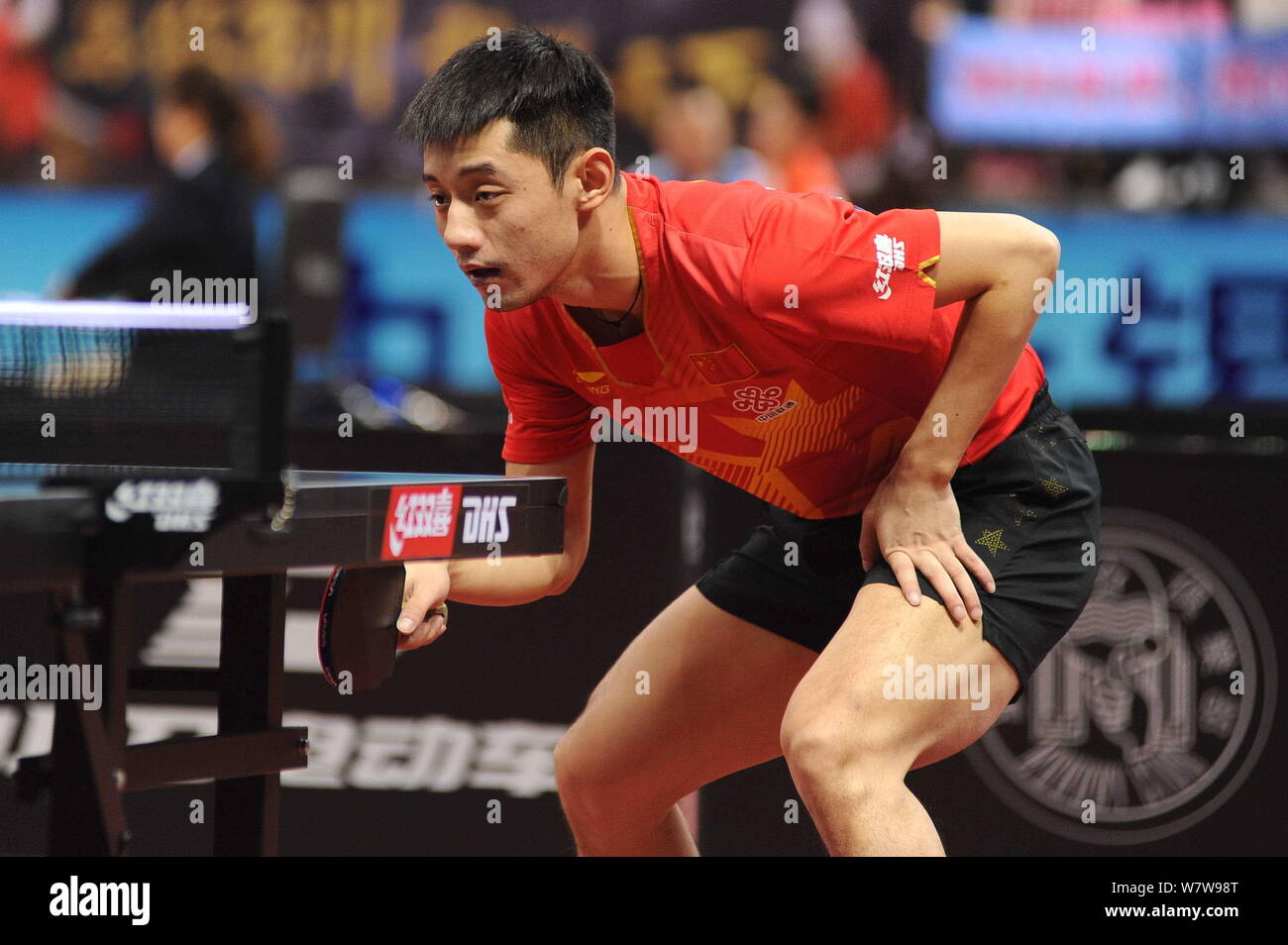 Zhang Jike of China returns a shot to Hung Tzu-Hsiang of Chinese Taipei ...